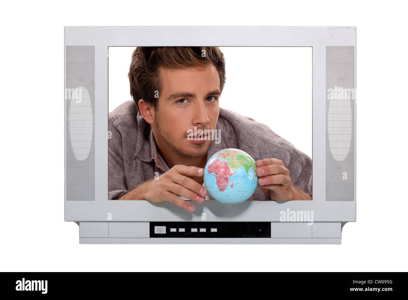 a 25 years old man behind a television screen is taking a little globe ...