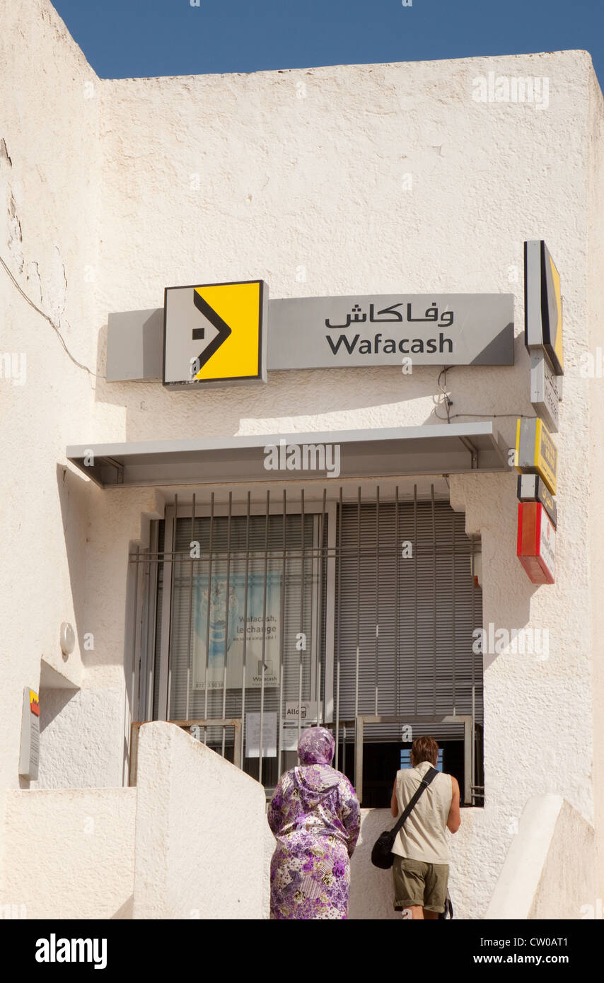 ATM machine Africa; People getting money from a Wafacash ATM cash ...