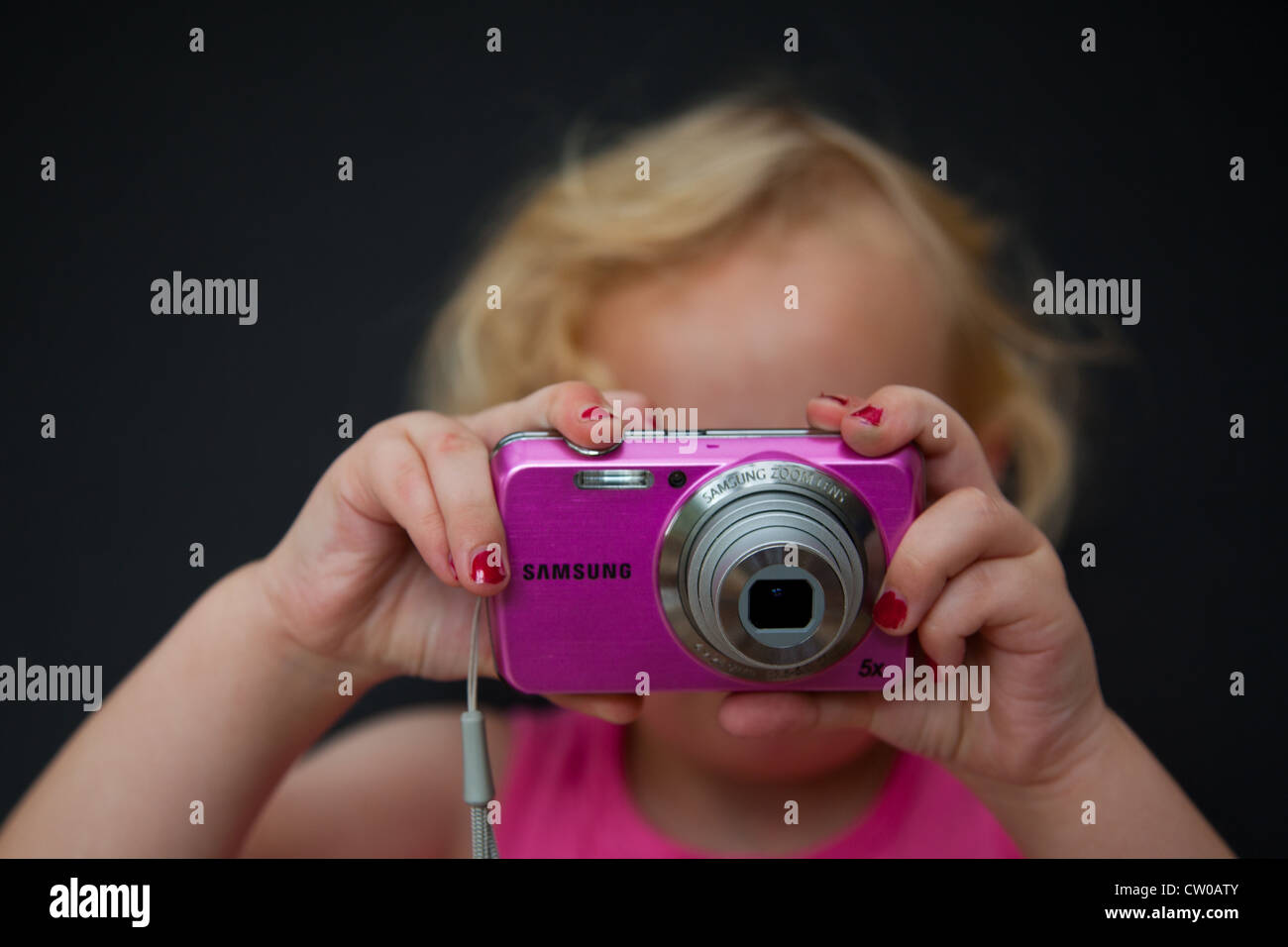 young girl with pink camera Stock Photo - Alamy