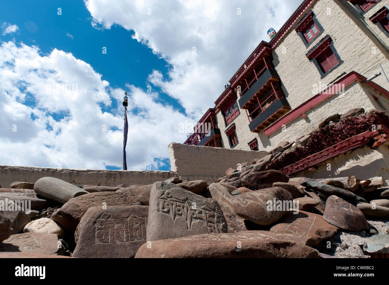 Stok Palace, Stok, Ladakh, India carved prayer stones in the foreground ...