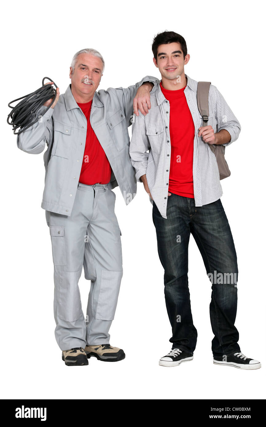 Electrician and his new helper Stock Photo - Alamy
