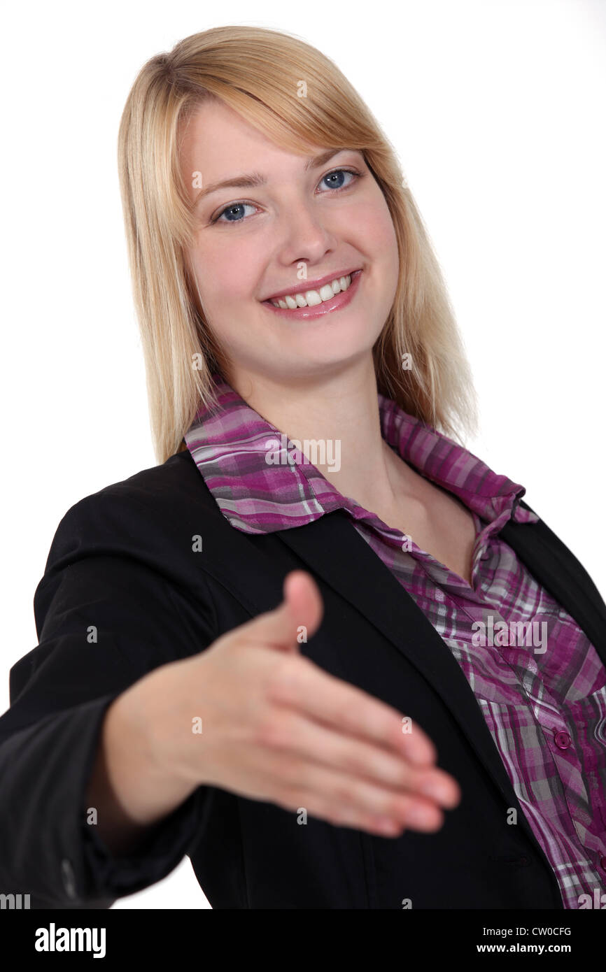 Blond woman holding hand out Stock Photo - Alamy