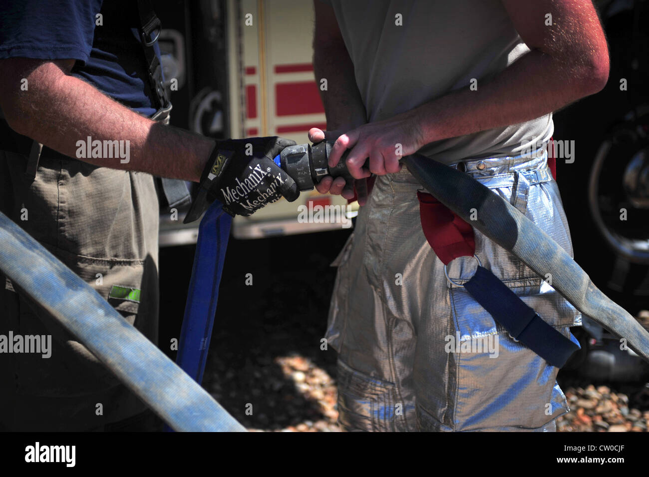 A member of Clovis, N.M., Fire Department and a firefighter with the ...
