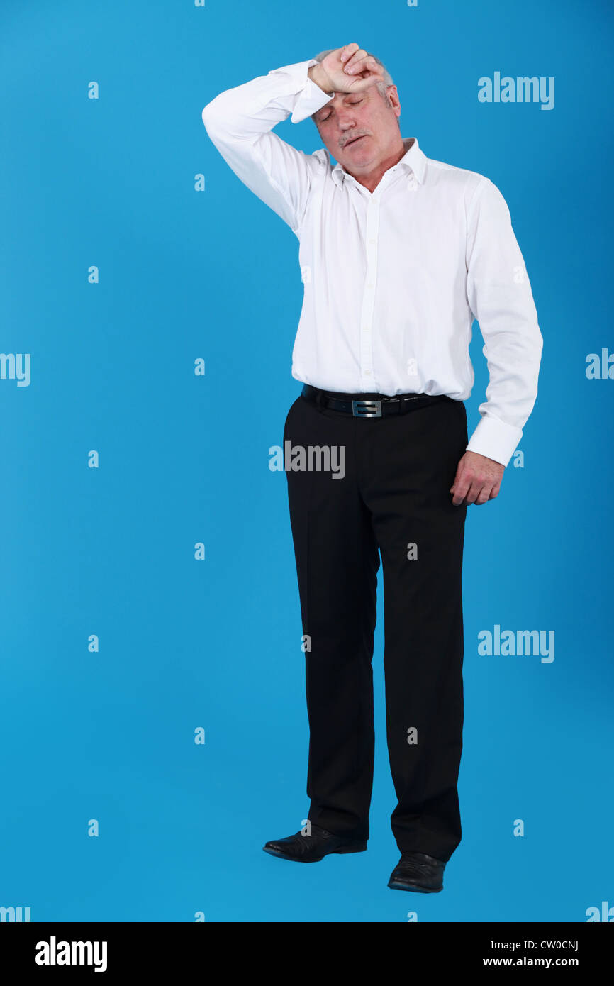 A mature businessman sweating Stock Photo - Alamy