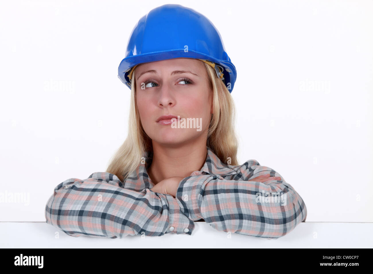 Female builder with confused look on her face Stock Photo - Alamy