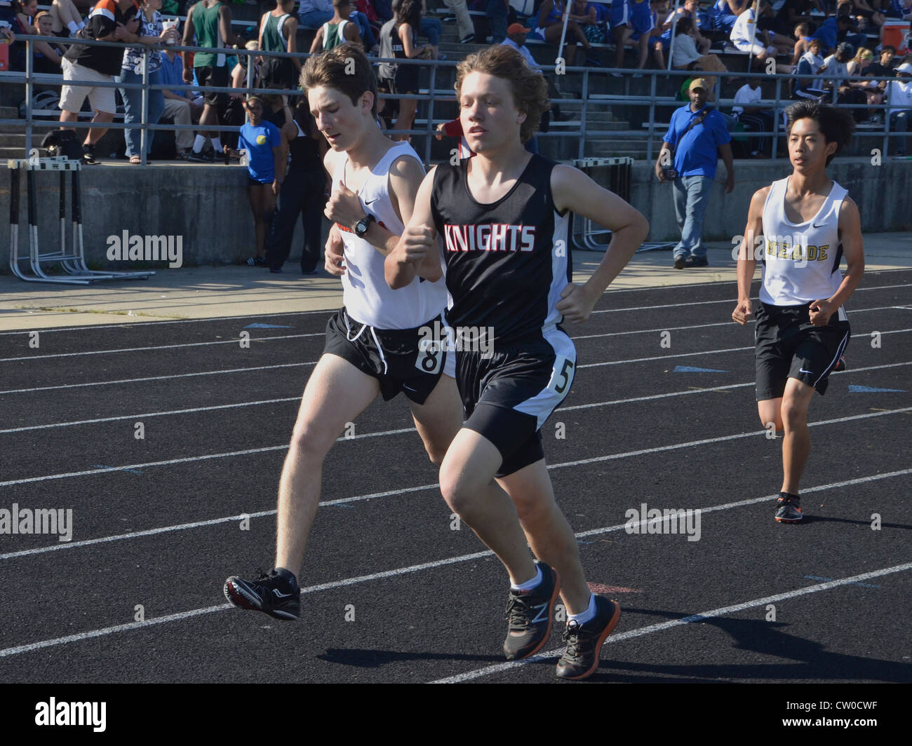 teens running in a high school track meet Stock Photo - Alamy