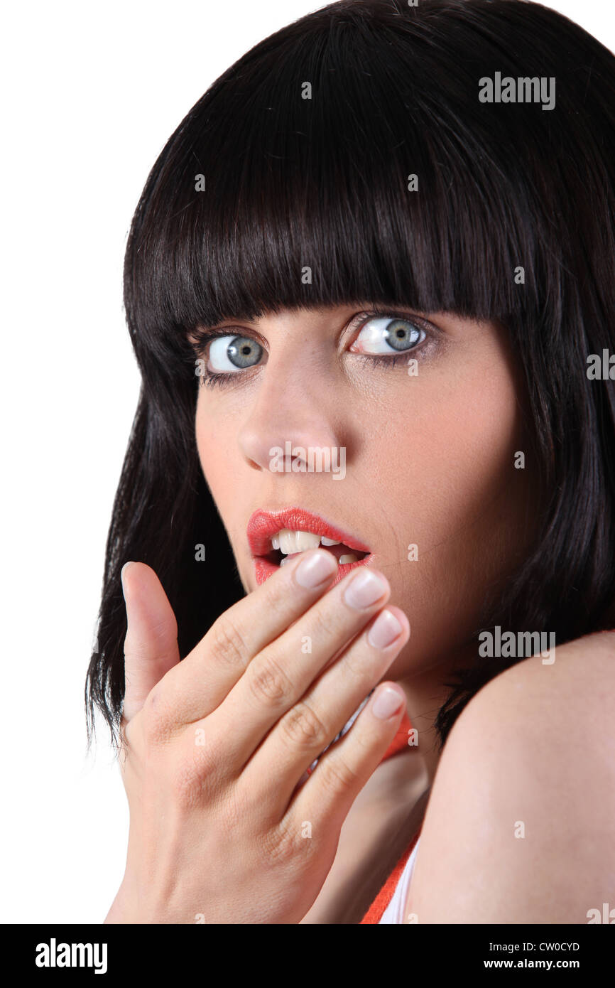 Young woman staring in shock Stock Photo - Alamy