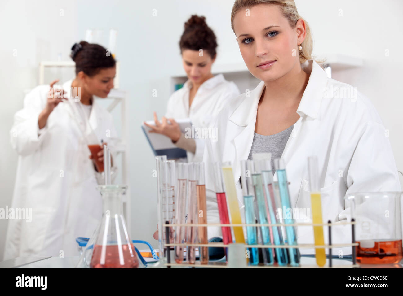 Three females in laboratory Stock Photo - Alamy
