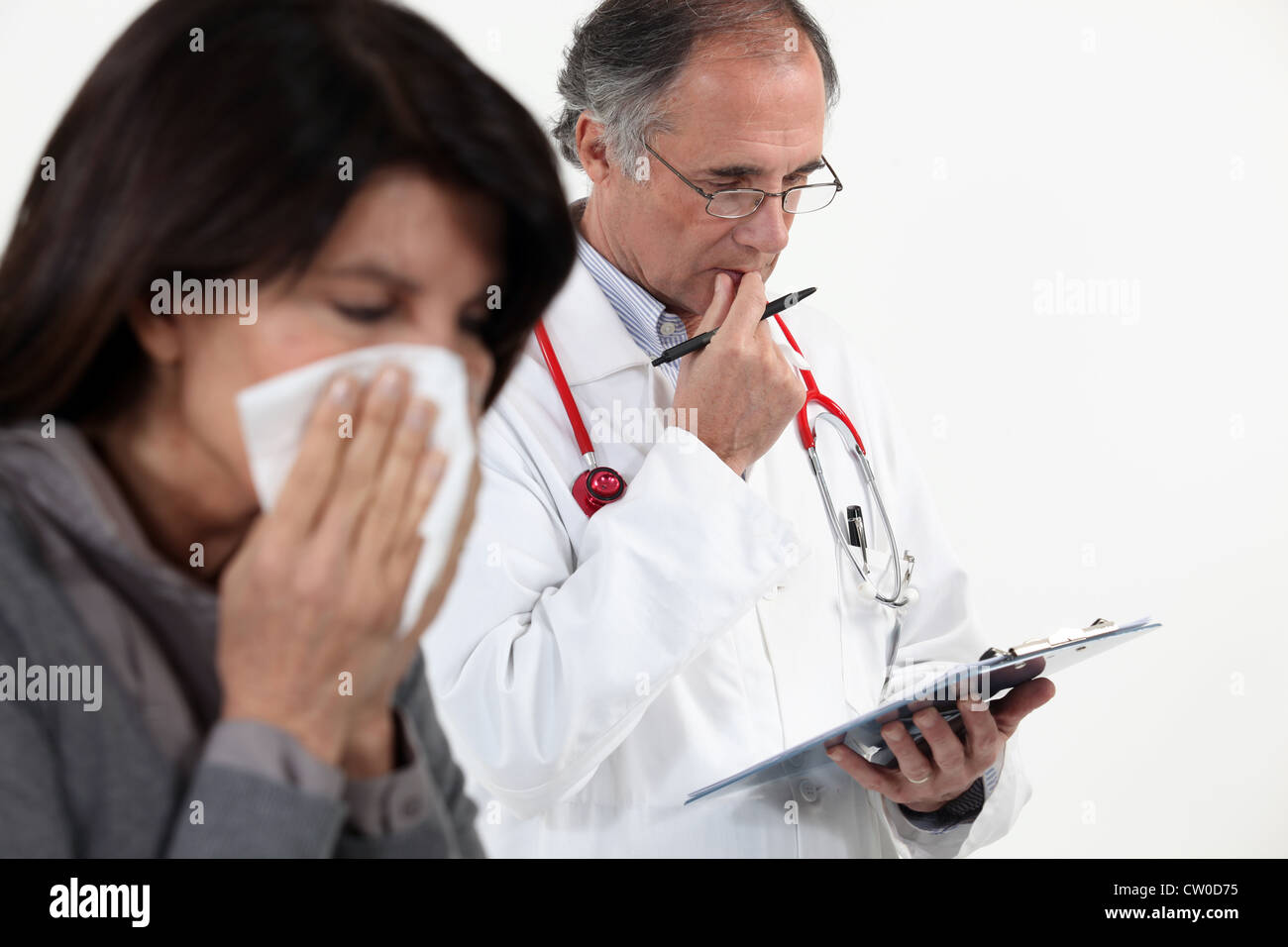 Doctor diagnosing a patient Stock Photo - Alamy
