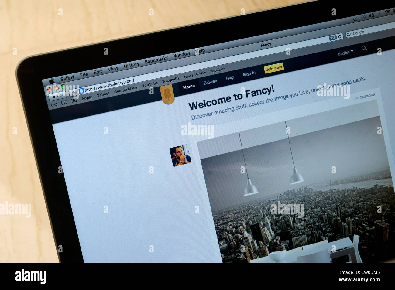 Laptop screen showing landing page of FANCY - social photo sharing ...