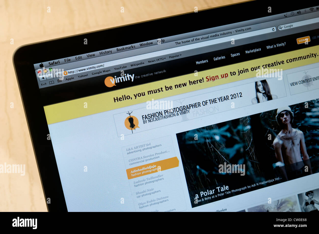 Laptop screen showing homepage of Vimity - creative network for visual ...