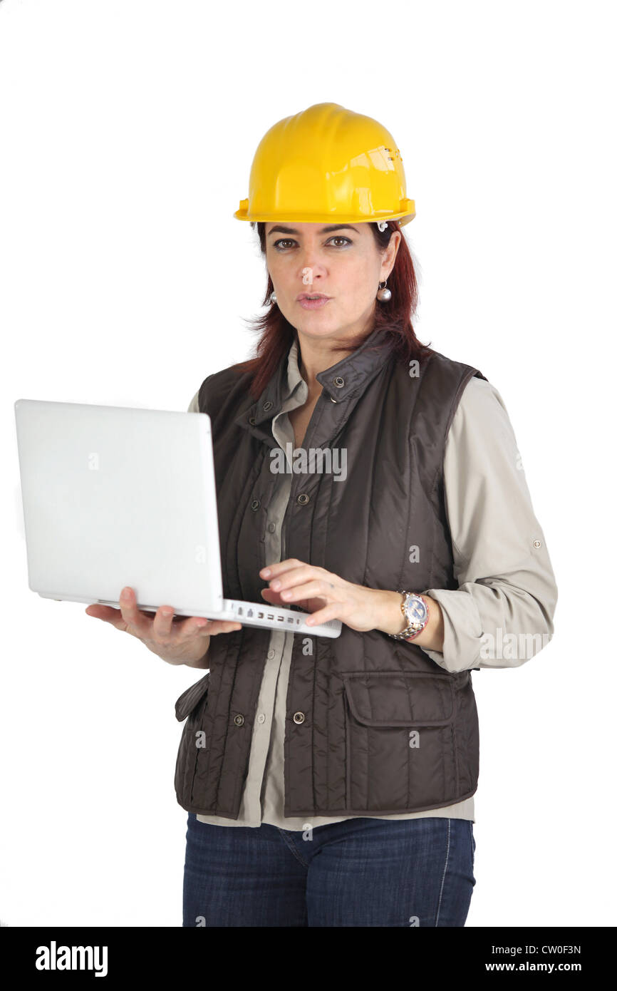 Female construction worker using her laptop Stock Photo - Alamy