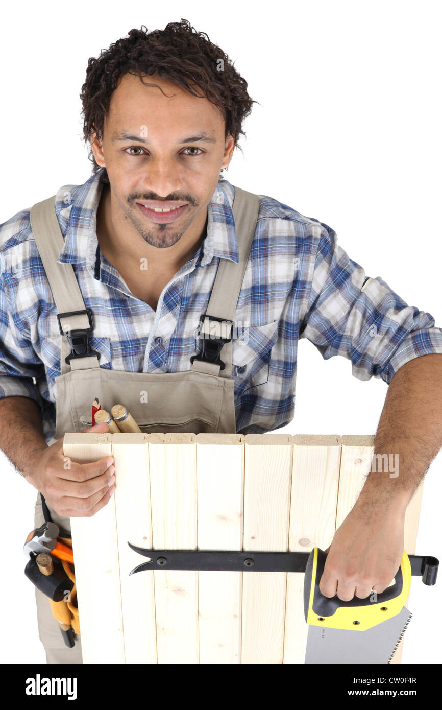 Carpenter with a saw Stock Photo - Alamy