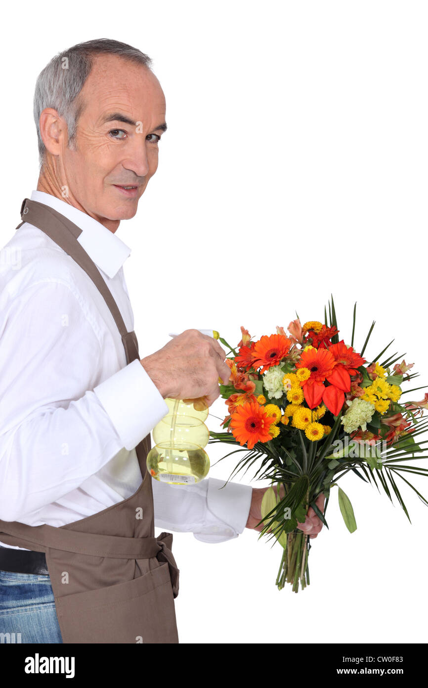 Florist spraying flowers Stock Photo - Alamy