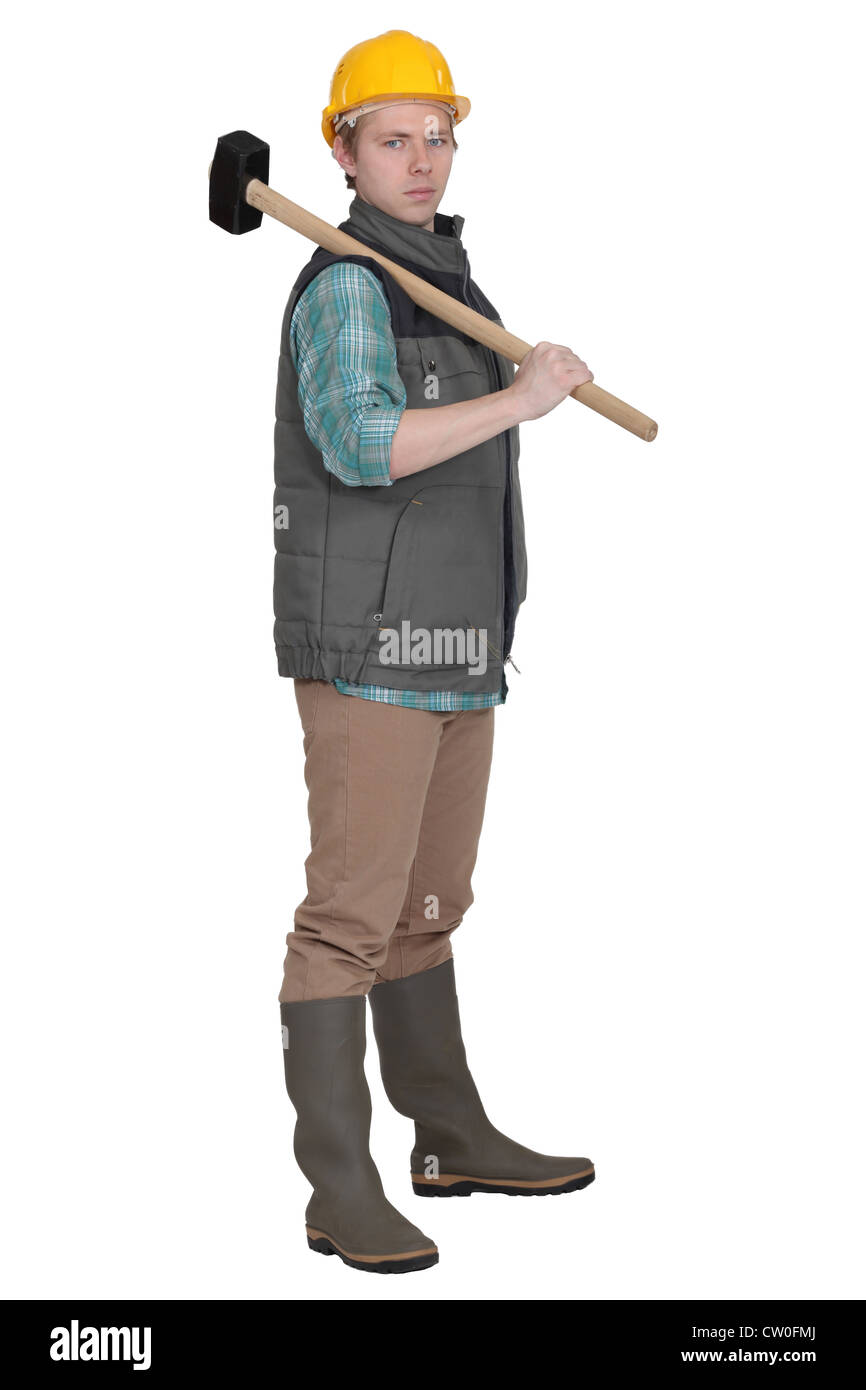 Young man with a sledgehammer Stock Photo - Alamy