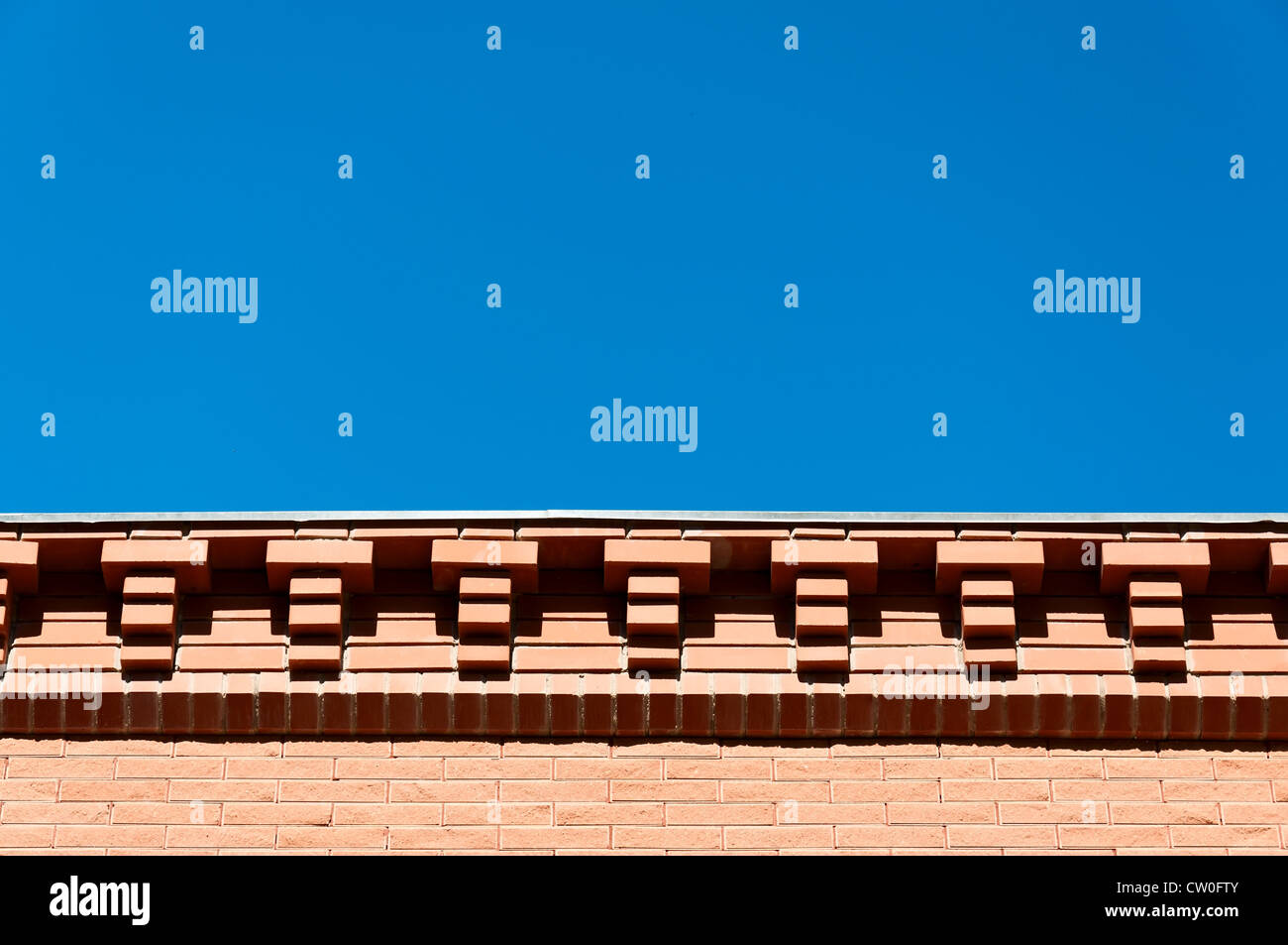 Decorative eaves from a red brick against the blue sky Stock Photo - Alamy