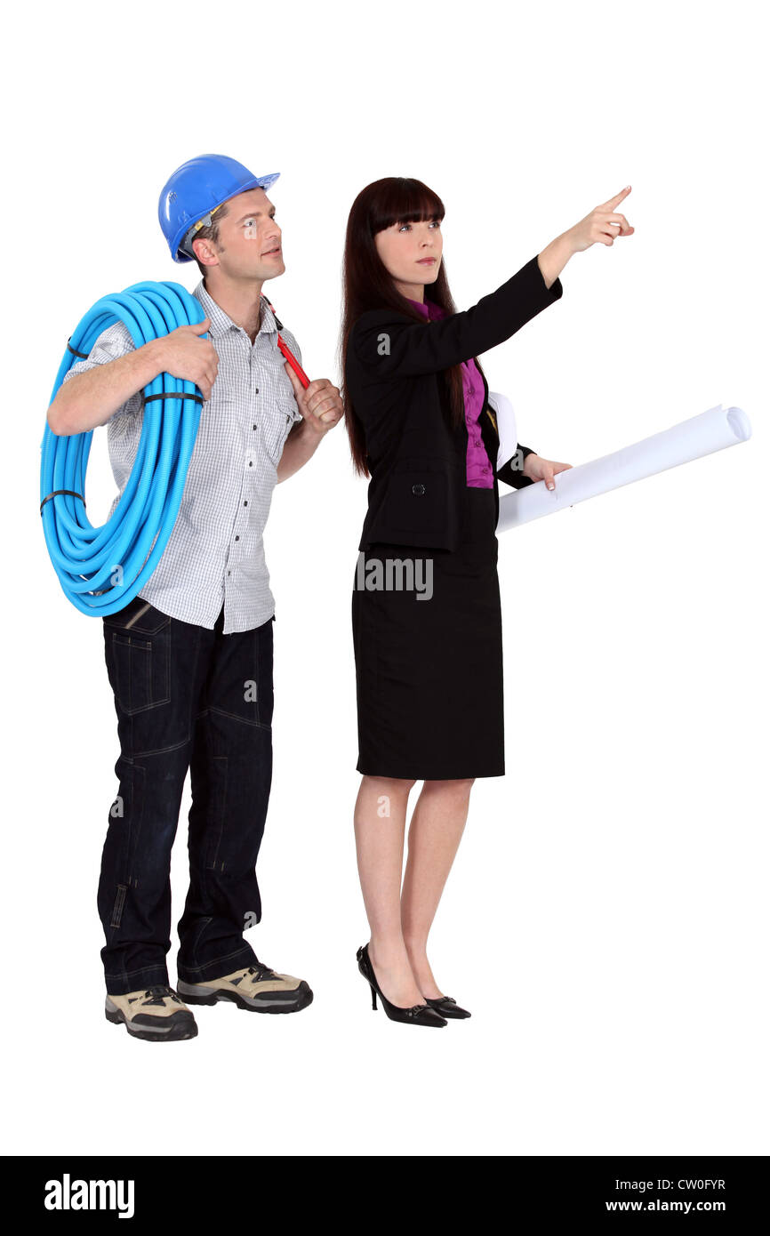 Architect and plumber discussing a project Stock Photo - Alamy