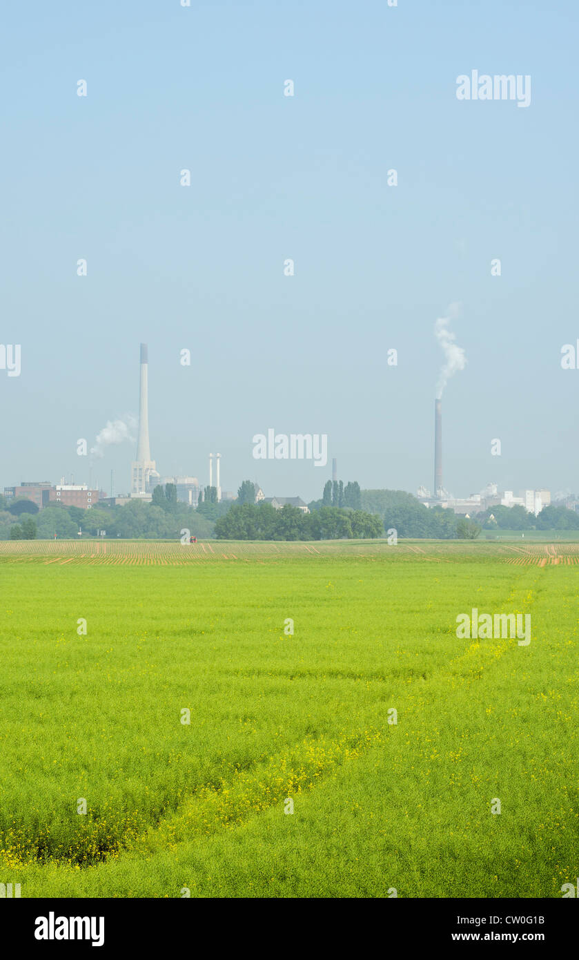 Industrial buildings by fields Stock Photo - Alamy
