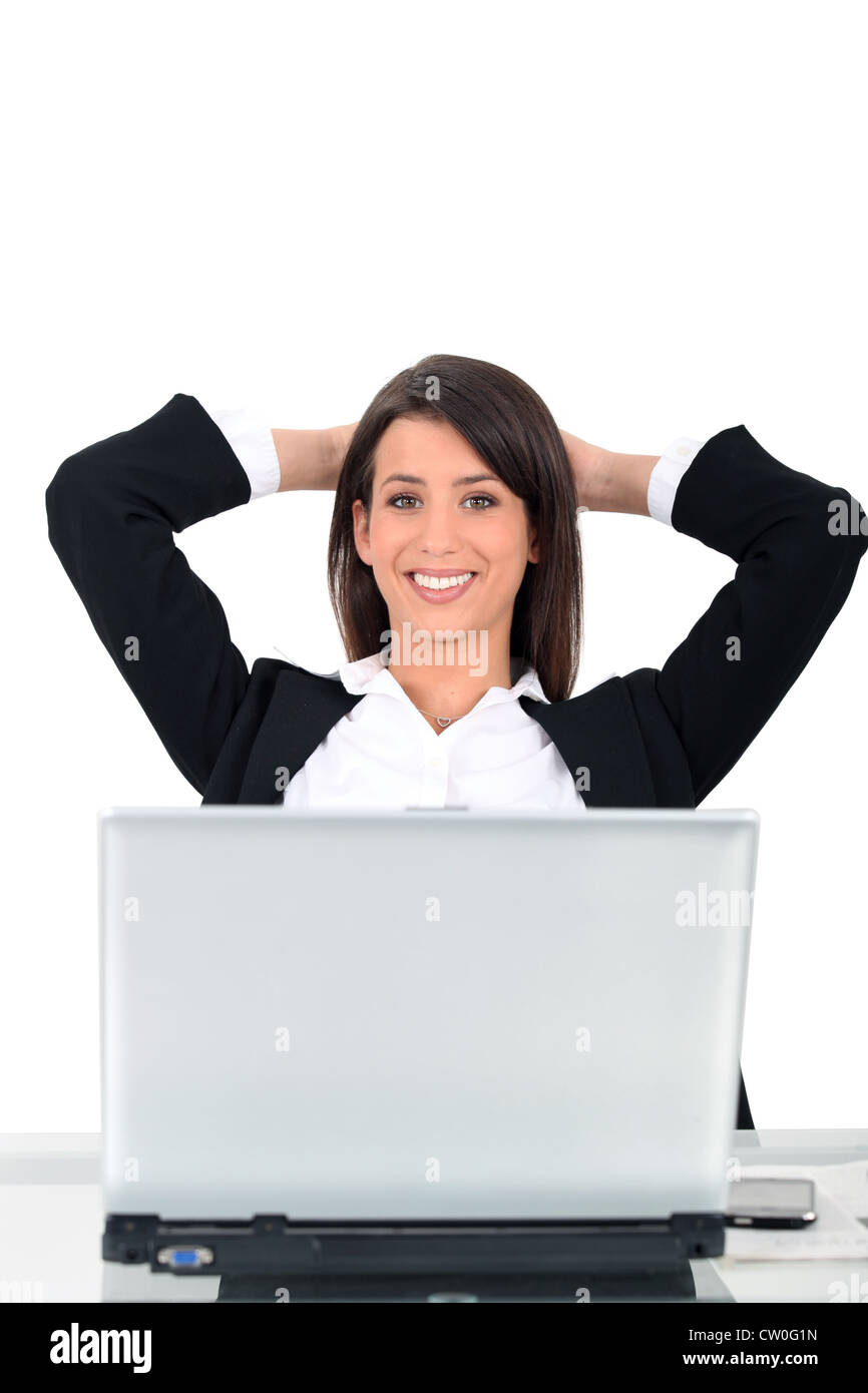 Business woman sat at desk in front of computer Stock Photo - Alamy