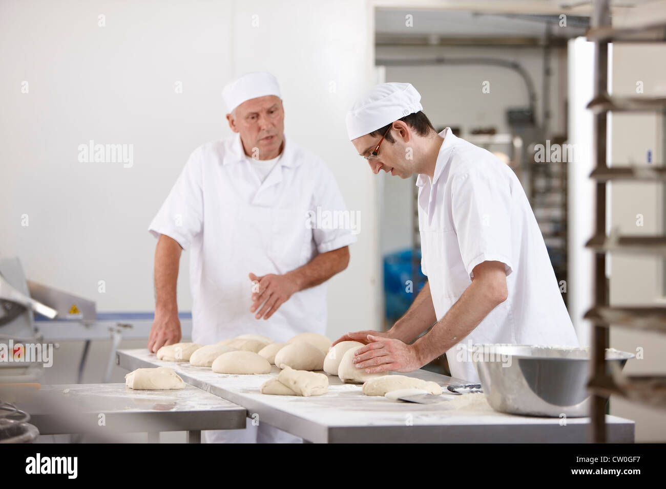 Chefs baking in kitchen Stock Photo - Alamy