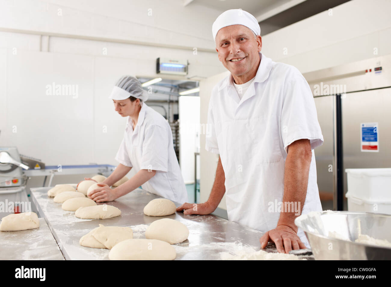 Chefs baking in kitchen Stock Photo - Alamy