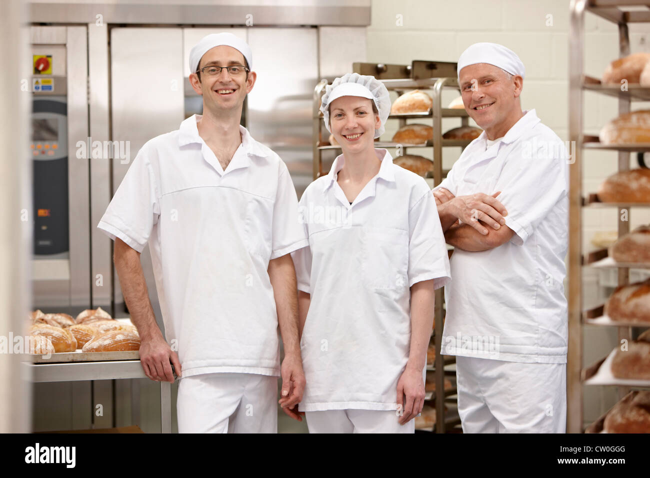 Chefs smiling together in kitchen Stock Photo - Alamy