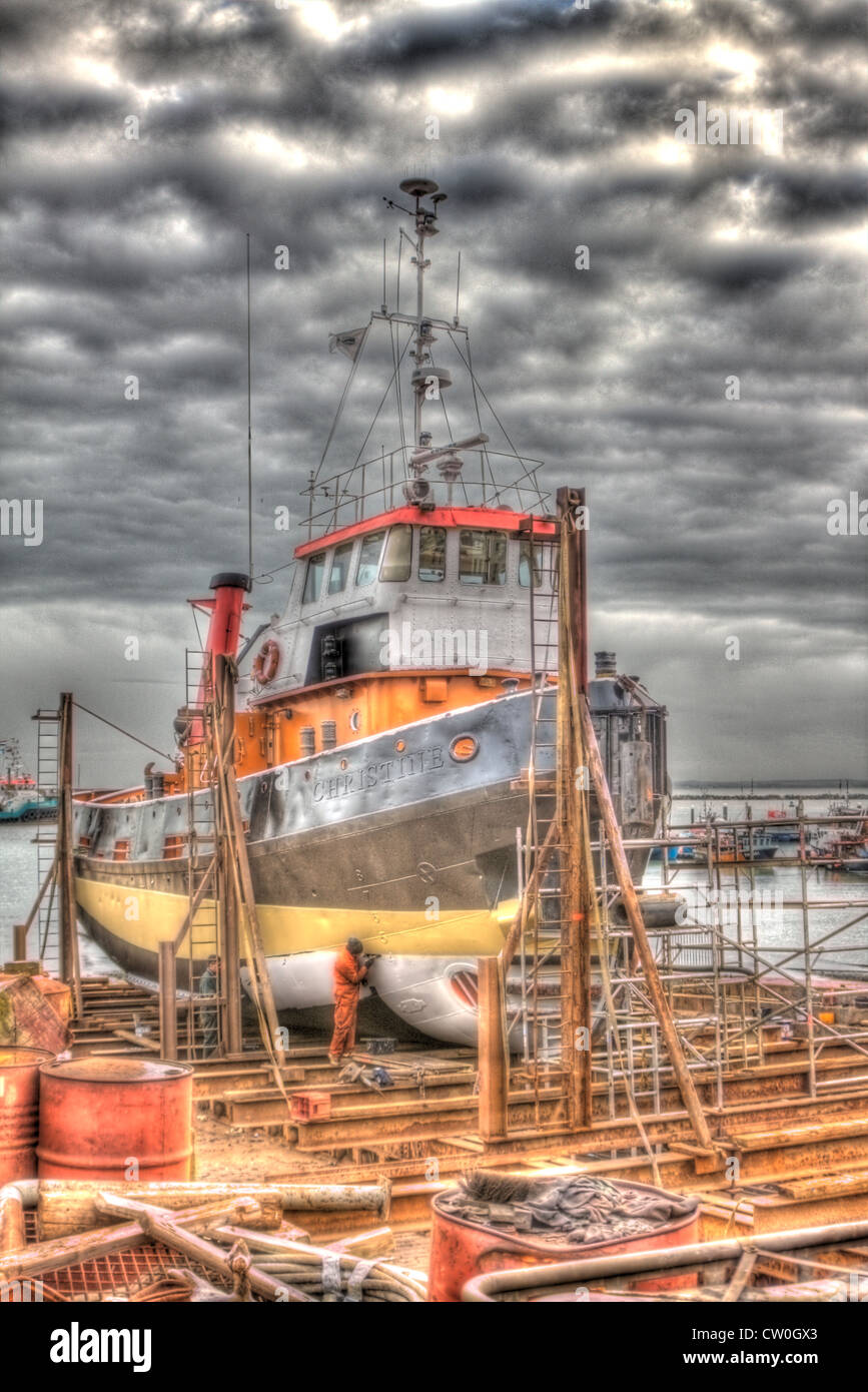 Ramsgate Harbor Docks, Kent. Trailer ship being repaired and painted ...
