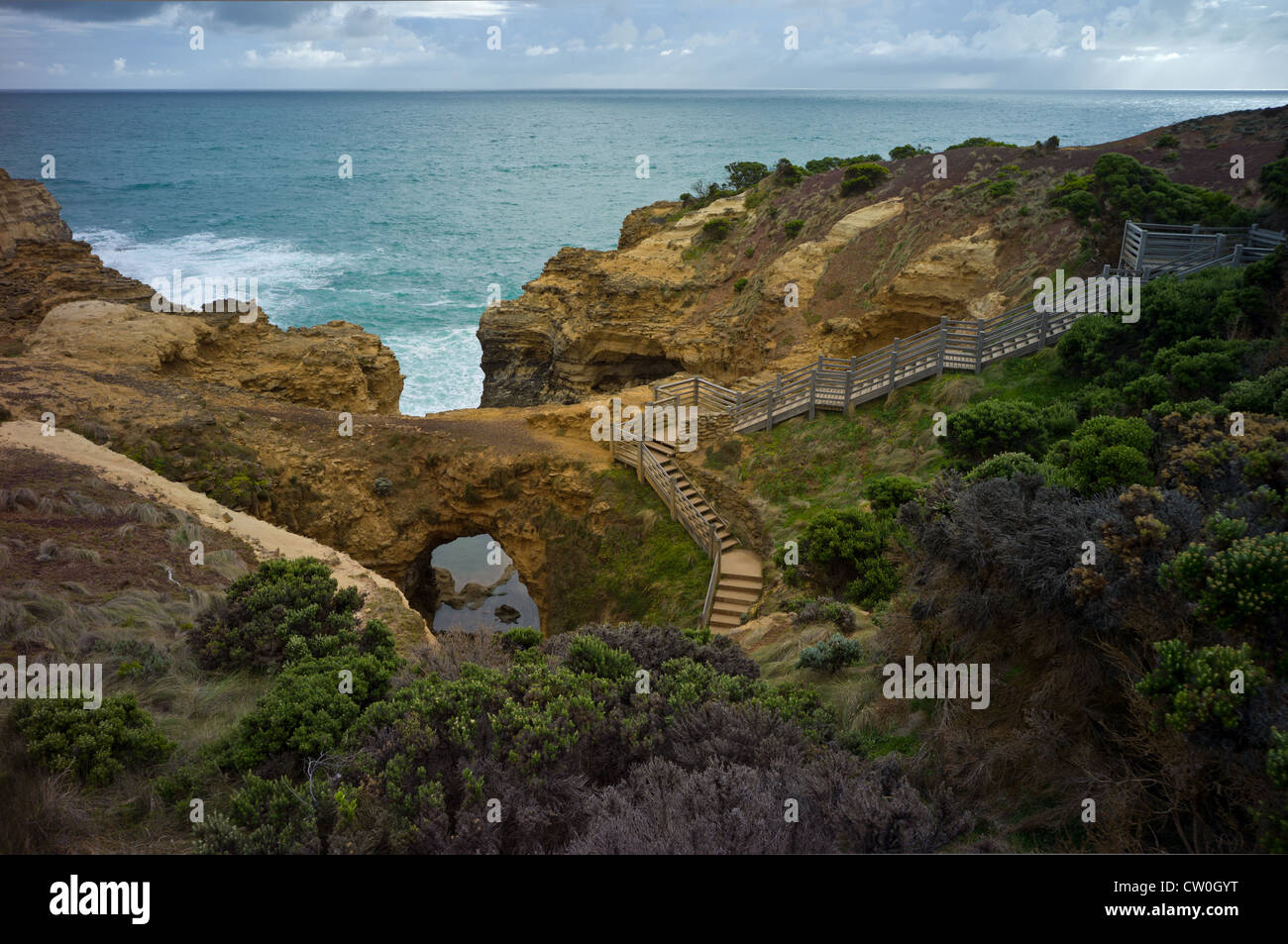 Winding Staircase constructed into cliff leading down to coastal grotto ...