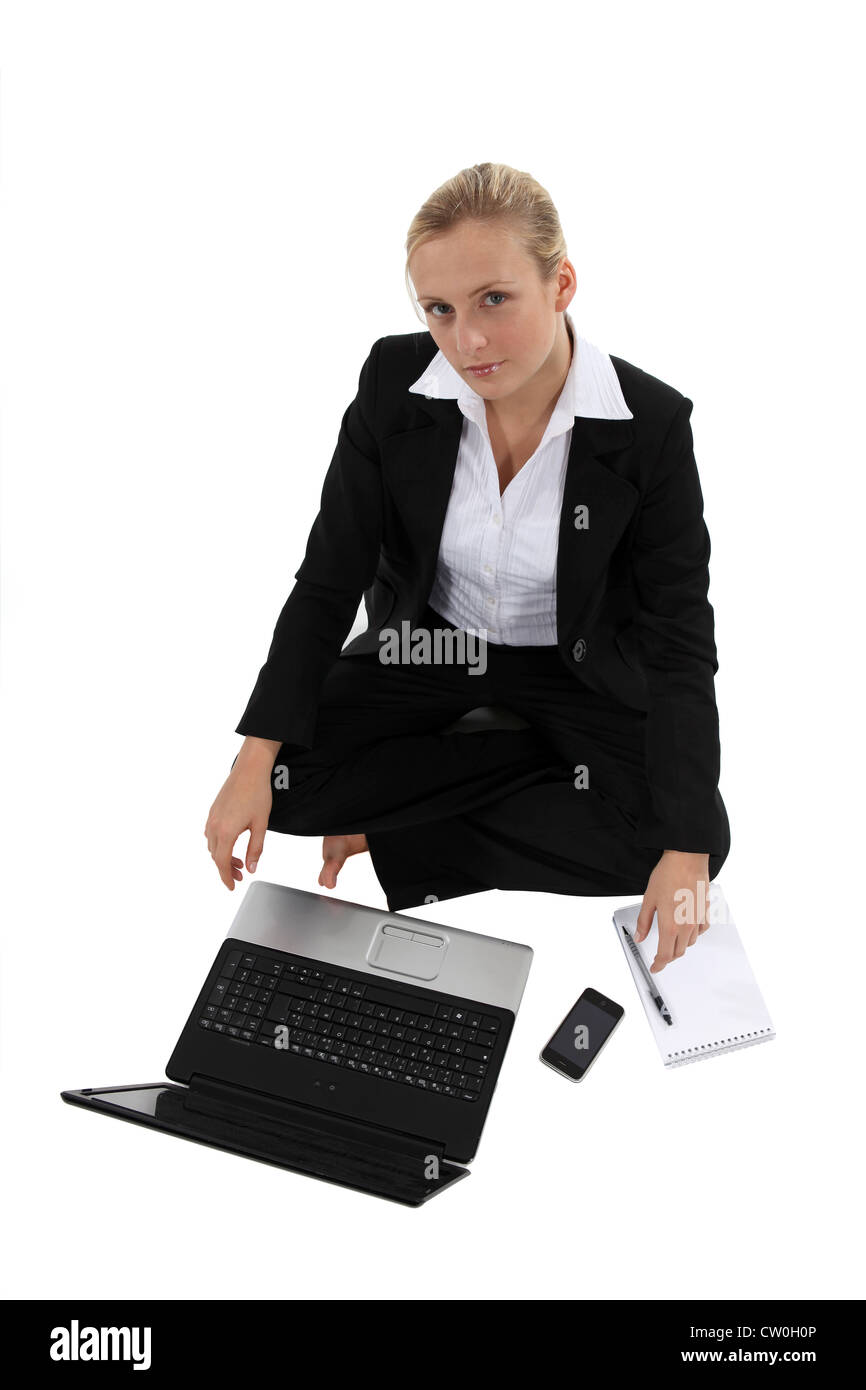 Businesswoman on the floor with computer Stock Photo - Alamy
