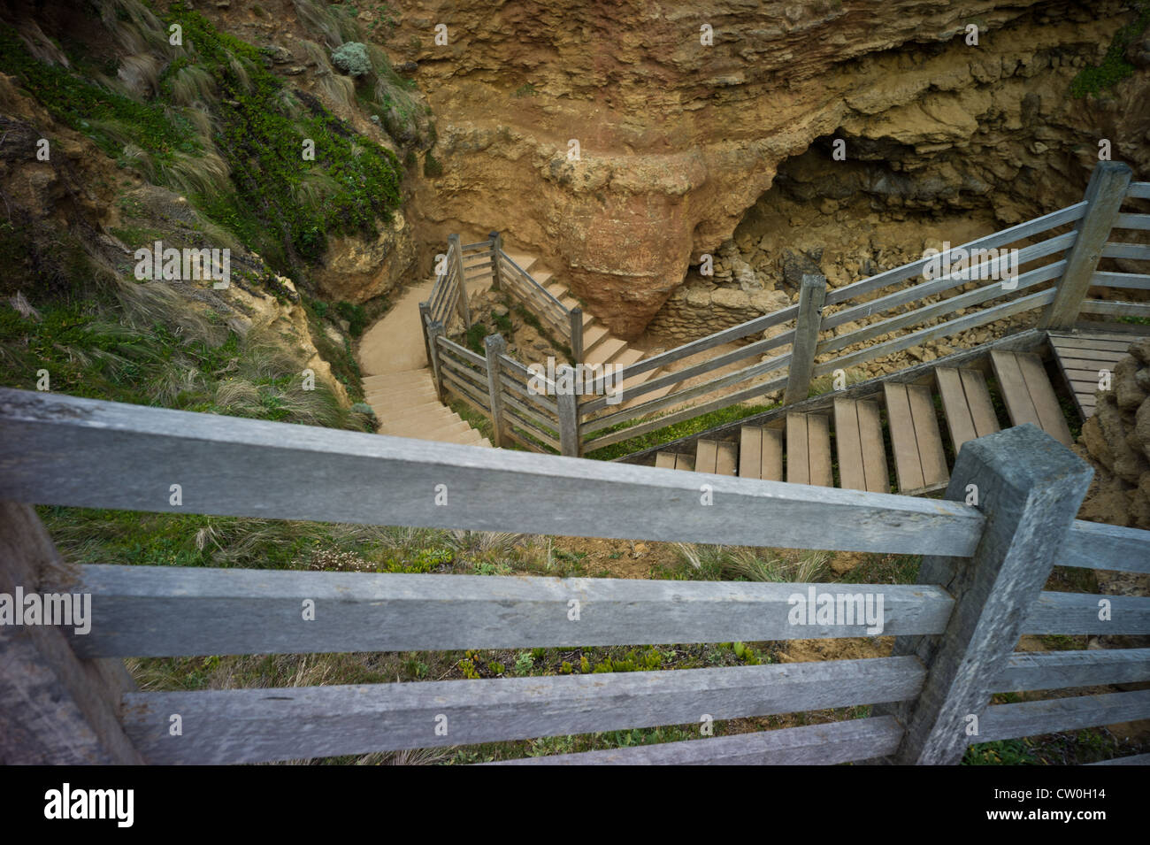 Winding Staircase constructed into cliff leading down to coastal grotto ...