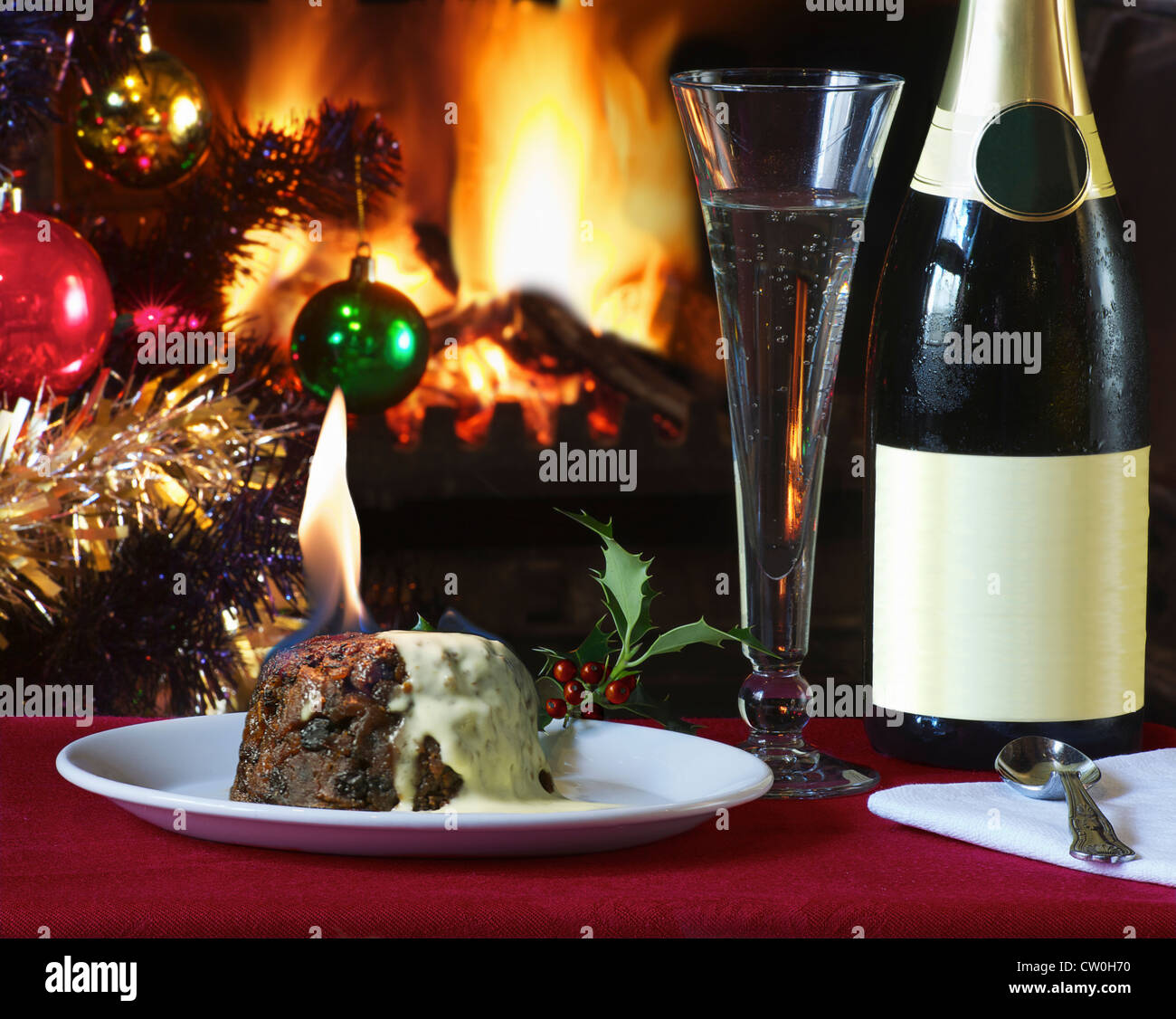 Plate of flaming Christmas pudding Stock Photo - Alamy