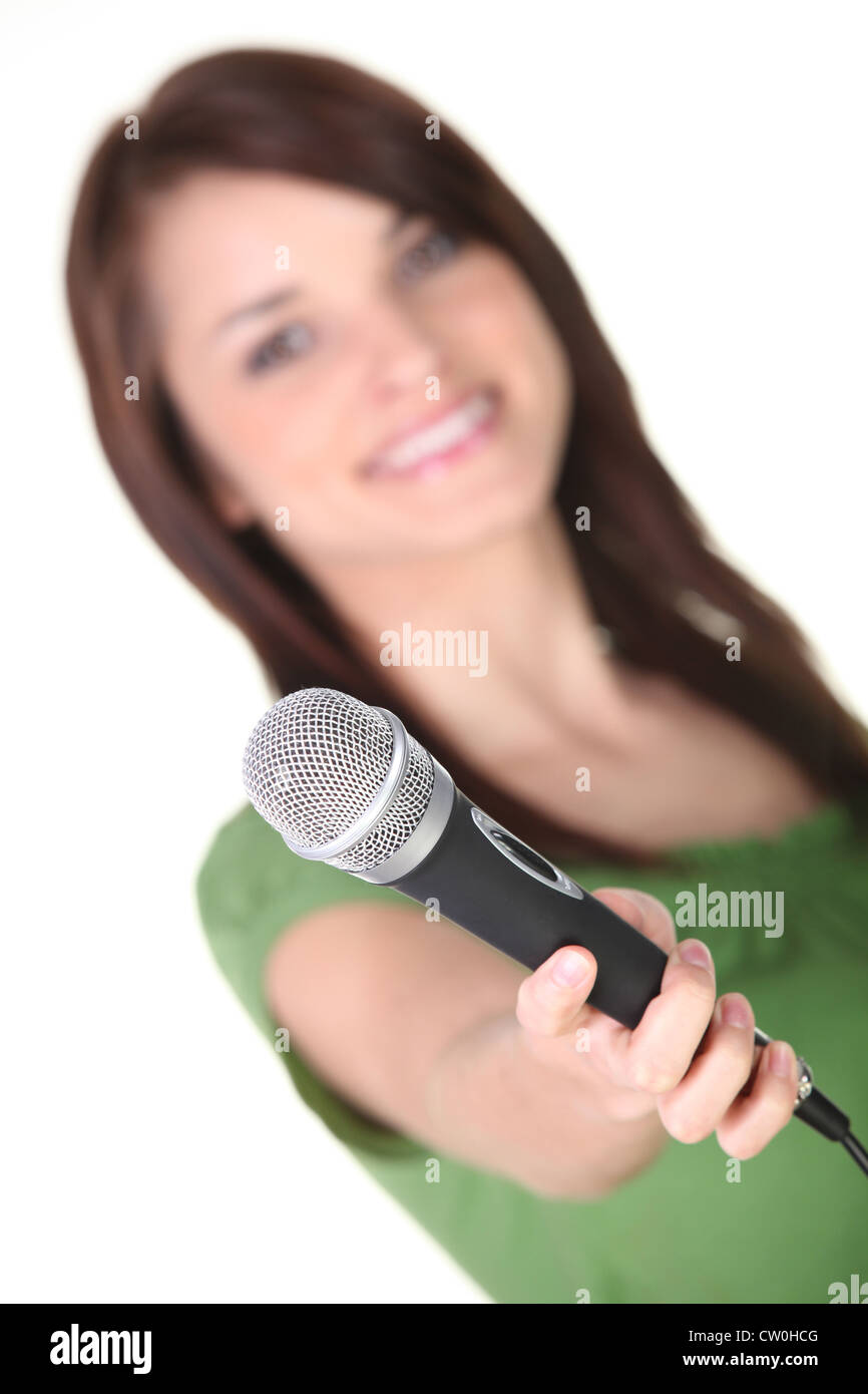 Woman holding a microphone Stock Photo - Alamy