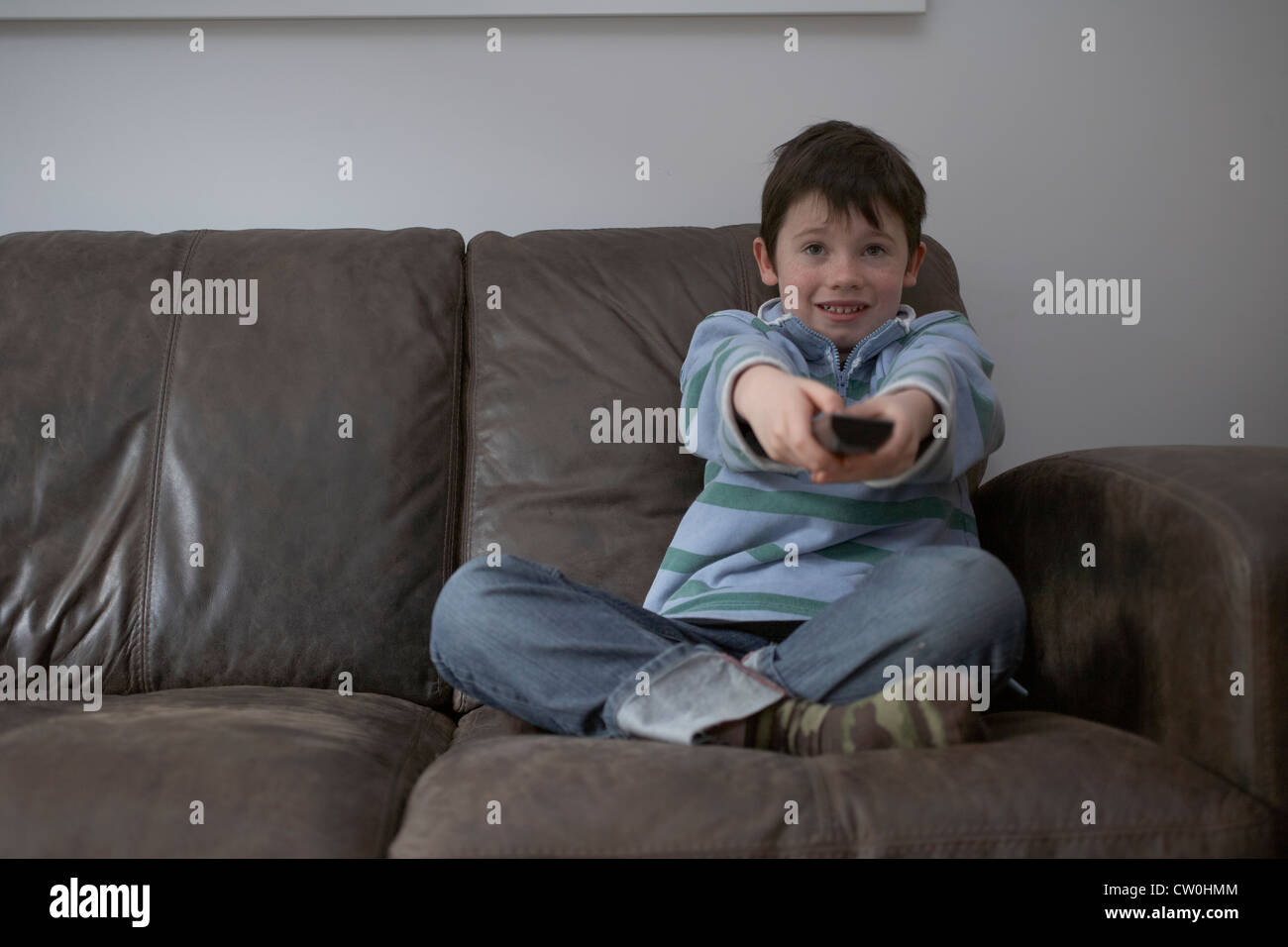 Boy watching tv in living hi-res stock photography and images - Alamy