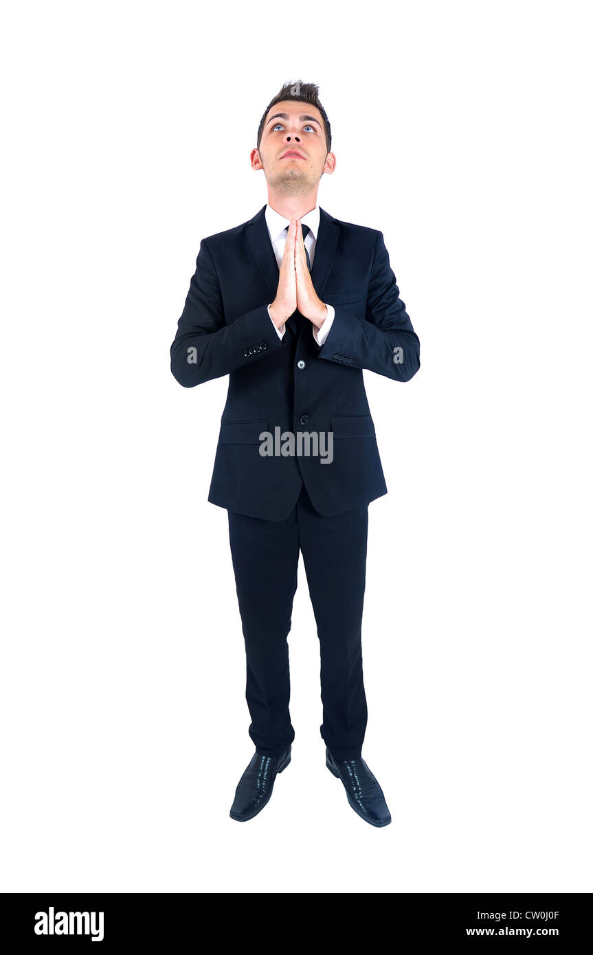 Isolated young business man praying Stock Photo - Alamy