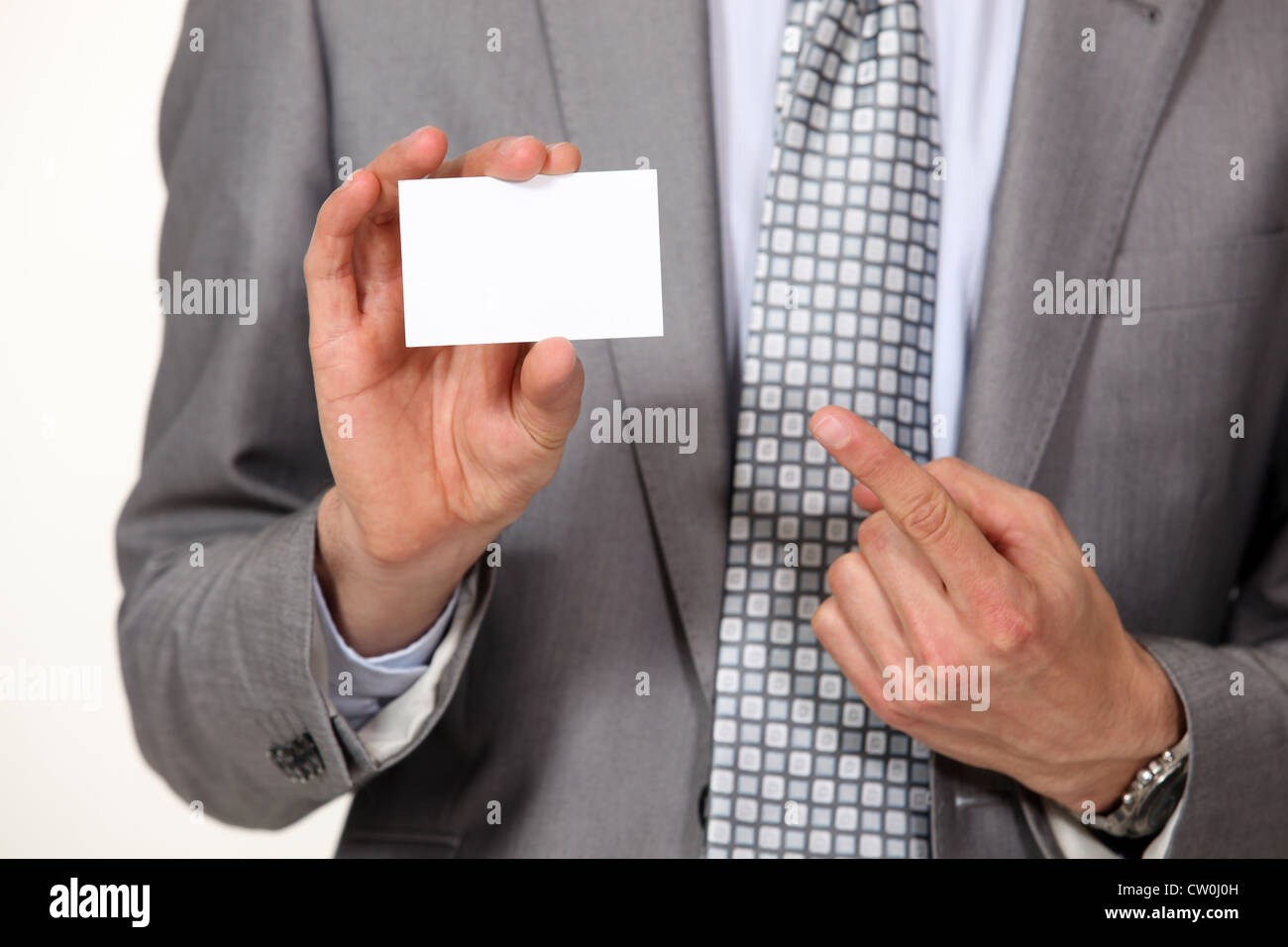 A cropped picture of a businessman showing his card Stock Photo - Alamy