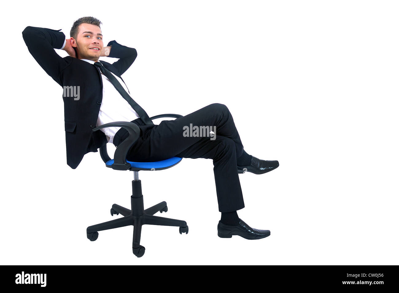 Isolated young business man relaxing on chair Stock Photo - Alamy