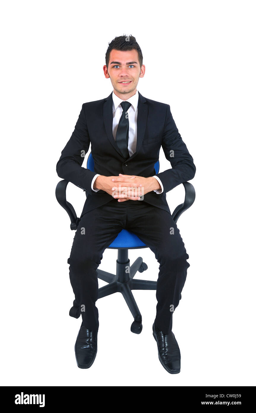 Isolated young business man standing on chair Stock Photo - Alamy