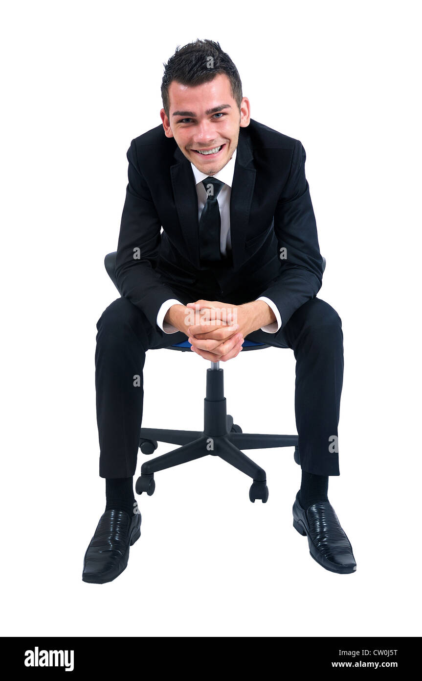 Isolated young business man standing on chair Stock Photo - Alamy