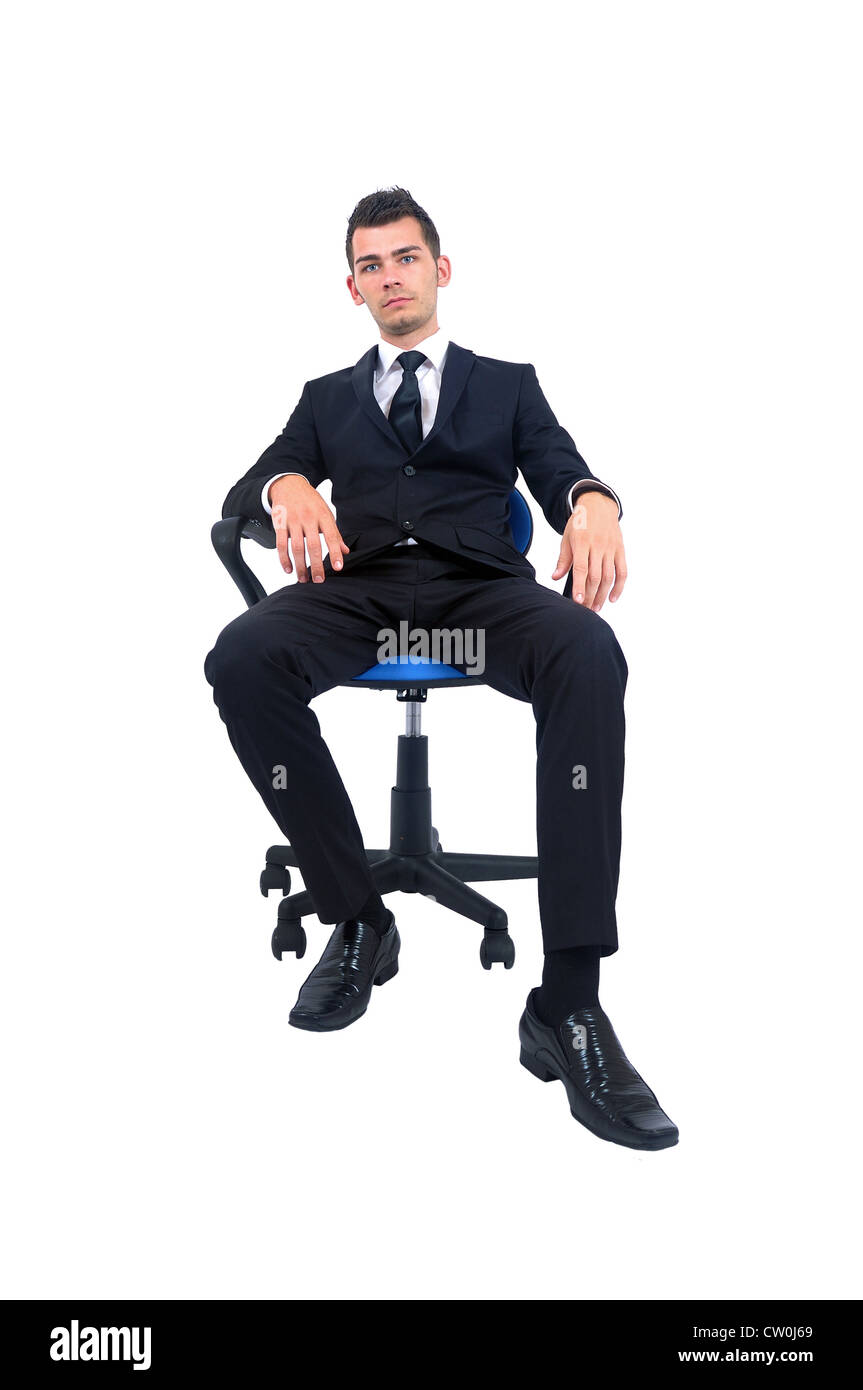 Isolated young business man standing on chair Stock Photo - Alamy