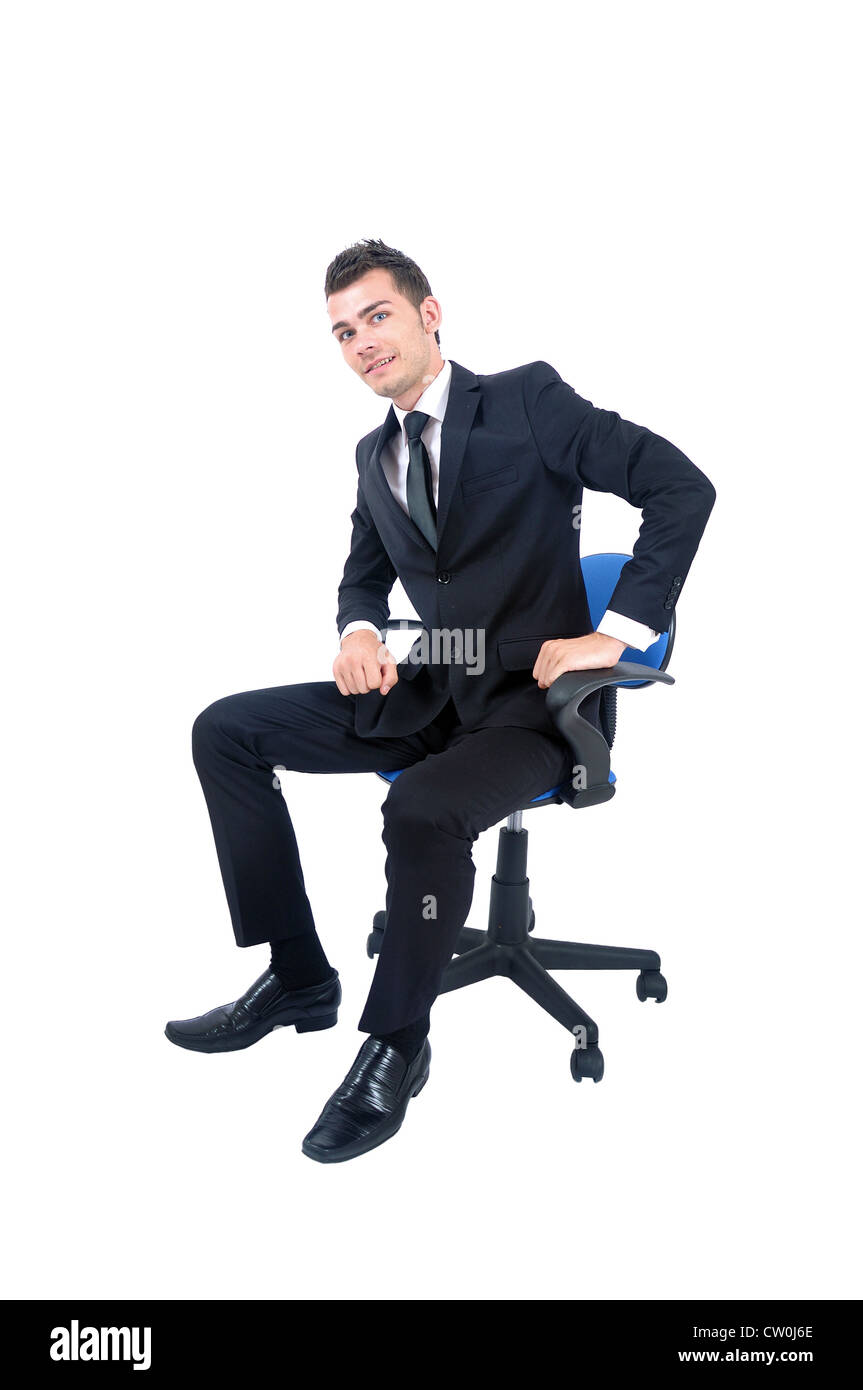 Isolated young business man standing on chair Stock Photo - Alamy