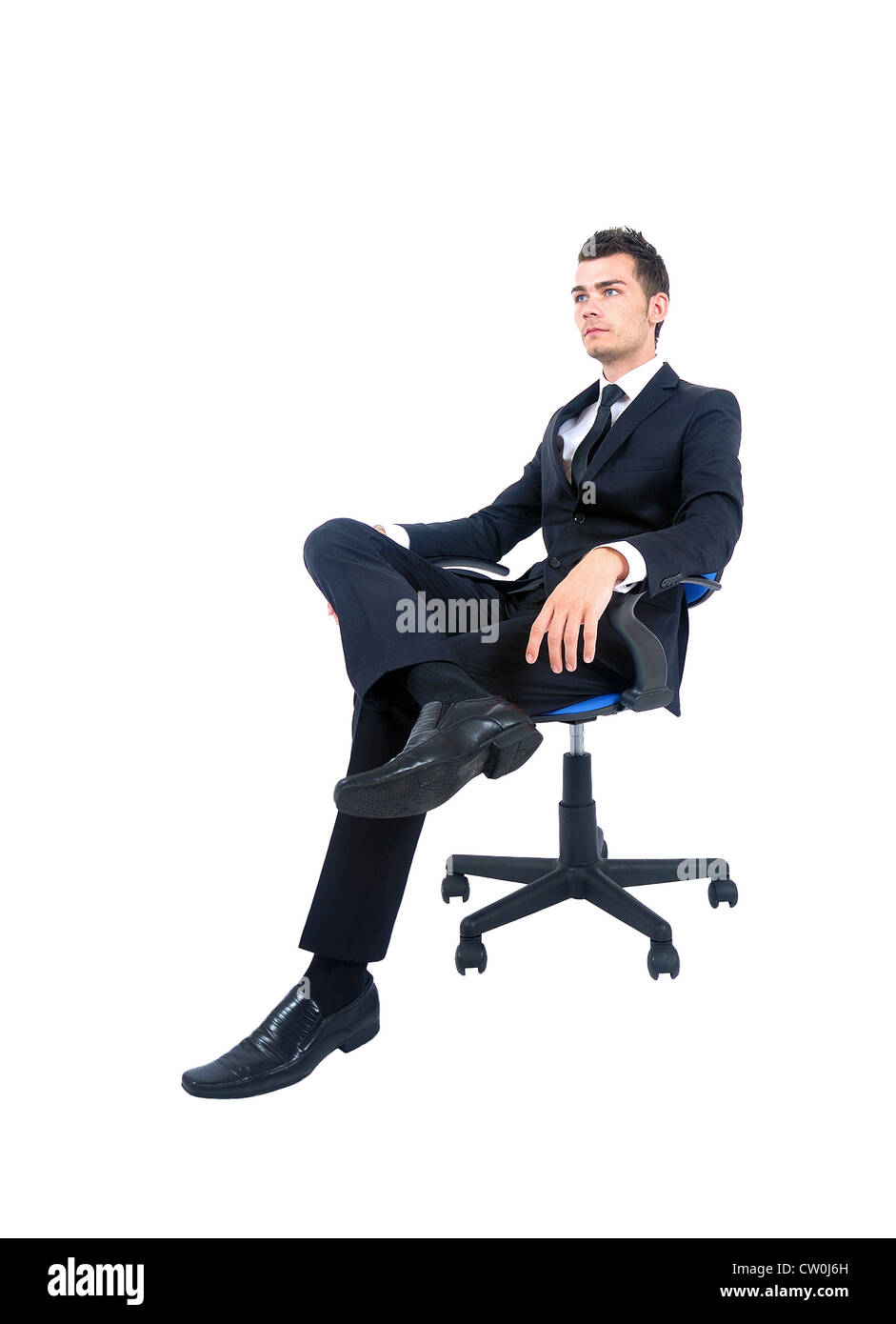 Isolated young business man standing on chair Stock Photo - Alamy