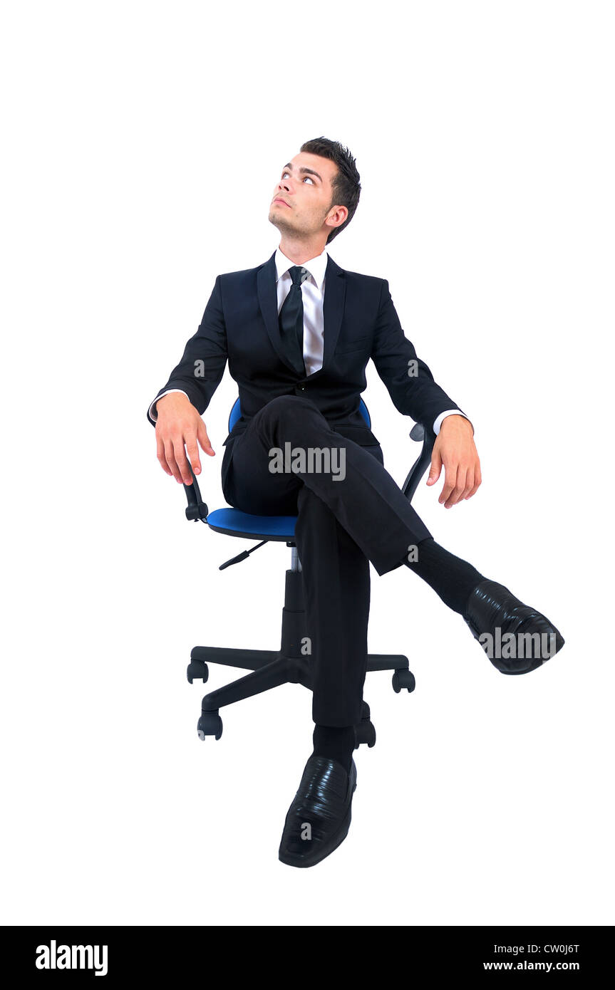 Isolated young business man standing on chair Stock Photo - Alamy