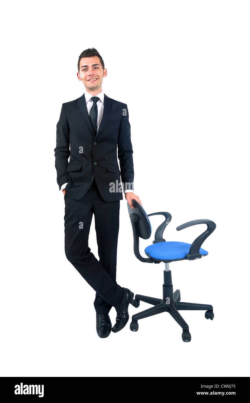 Isolated young business man with chair Stock Photo - Alamy