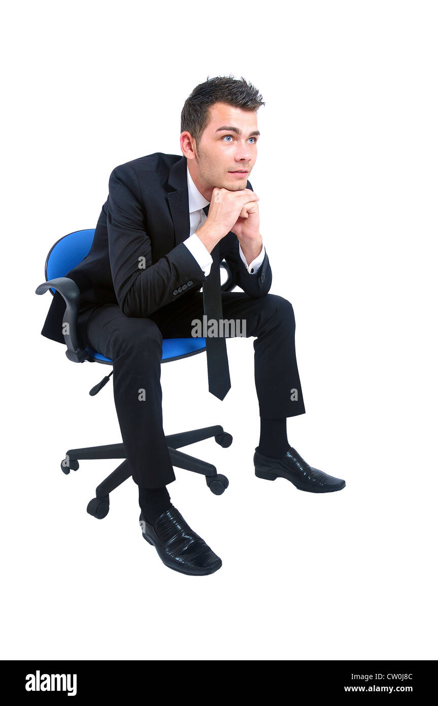 Isolated young business man on chair Stock Photo - Alamy