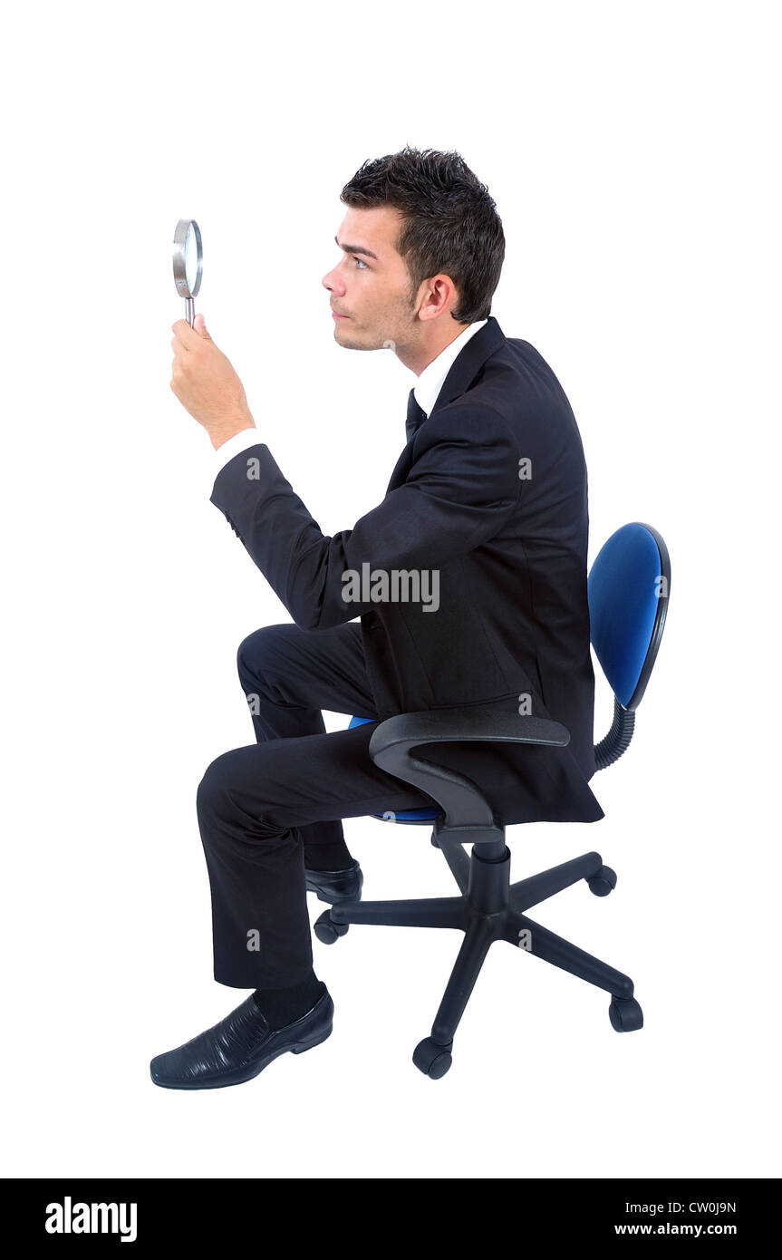Isolated young business man with magnifying glass Stock Photo - Alamy