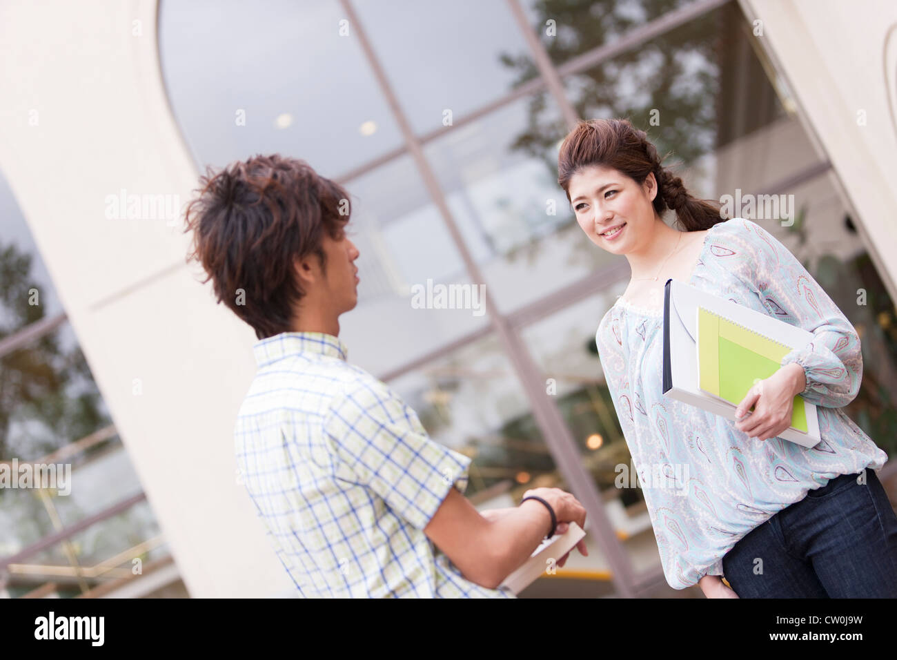 Two university students talking Stock Photo - Alamy