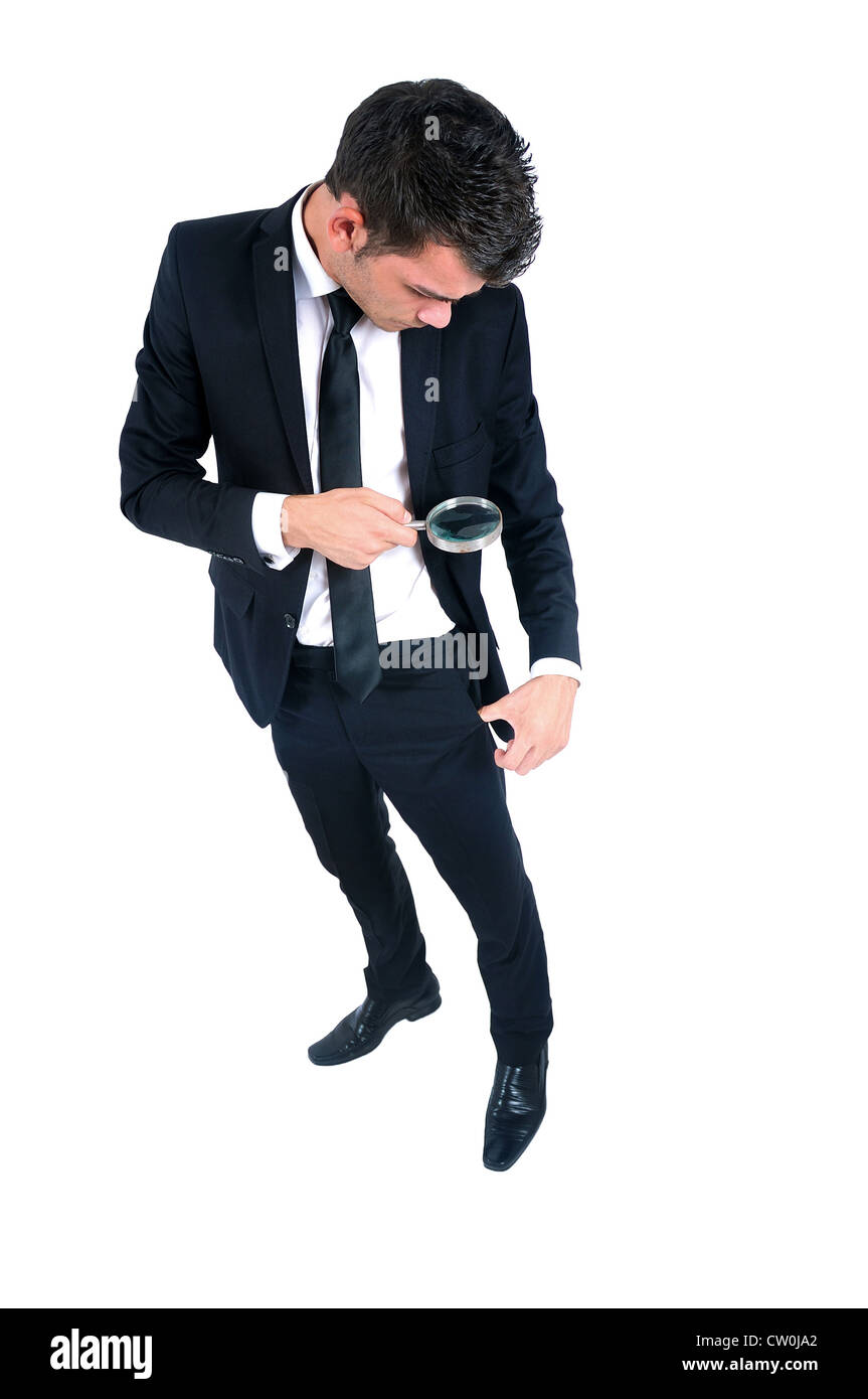 Isolated young business man with magnifying glass Stock Photo - Alamy