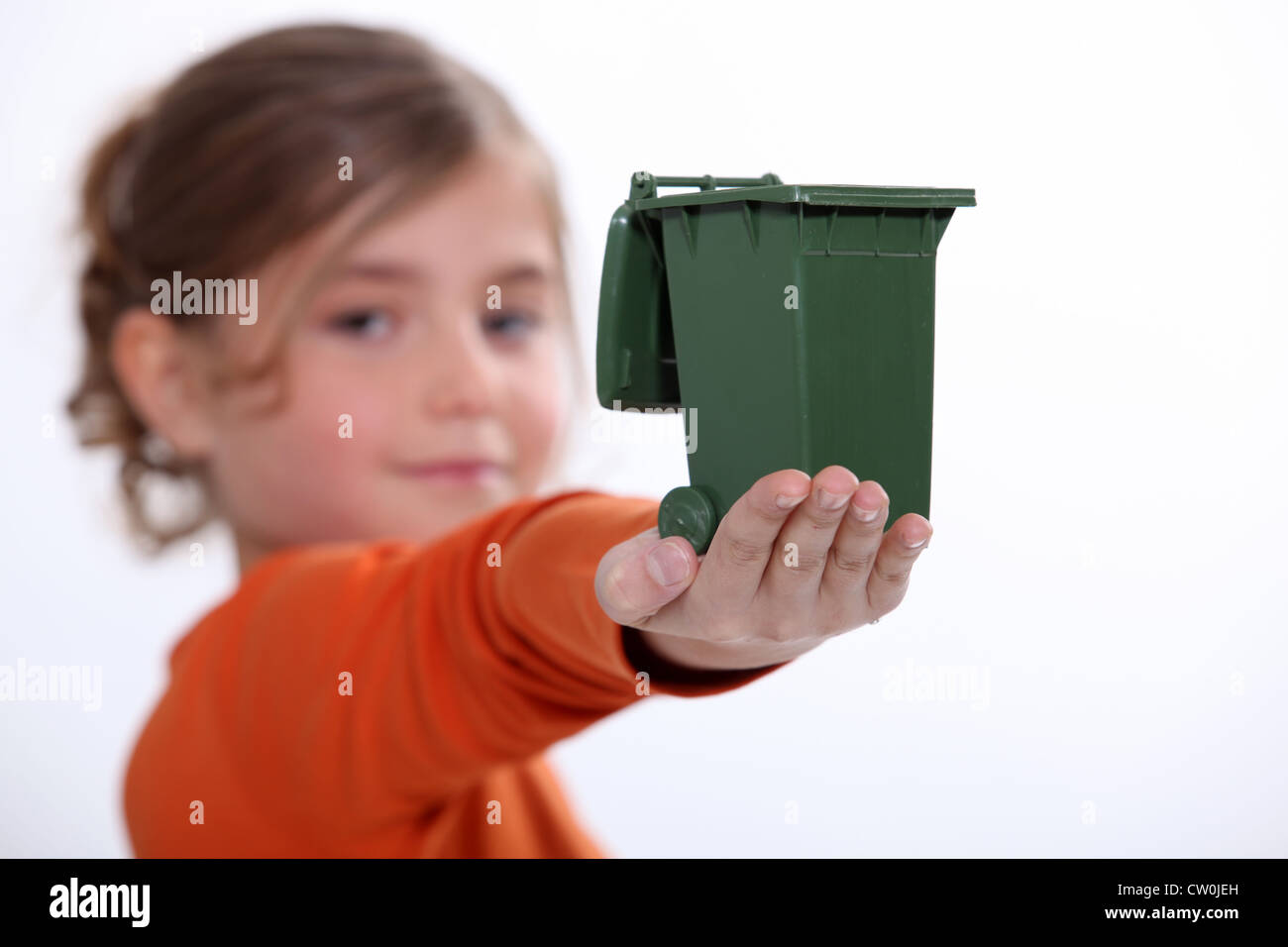 Child holding mini recycling bin Stock Photo - Alamy