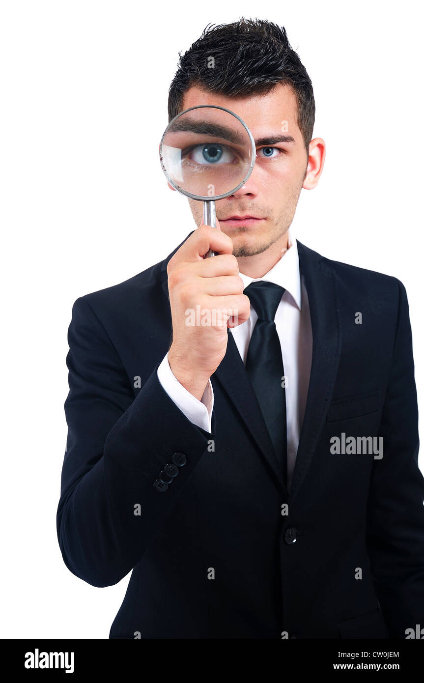 Isolated young business man with magnifying glass Stock Photo - Alamy