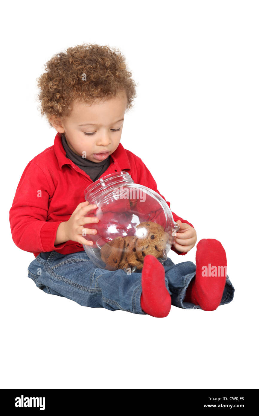Boy eating biscuit Cut Out Stock Images & Pictures - Alamy